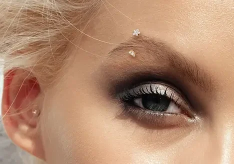 Unveiling the Barbell Eyebrow Piercing Mystique - The Body Rings